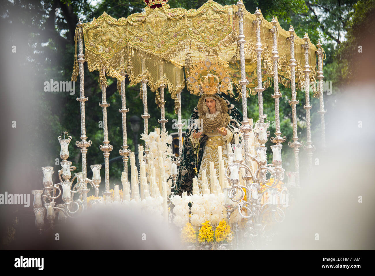 Virgin Mary on palm sunday (easter week). Heavy figure that is moved by ...