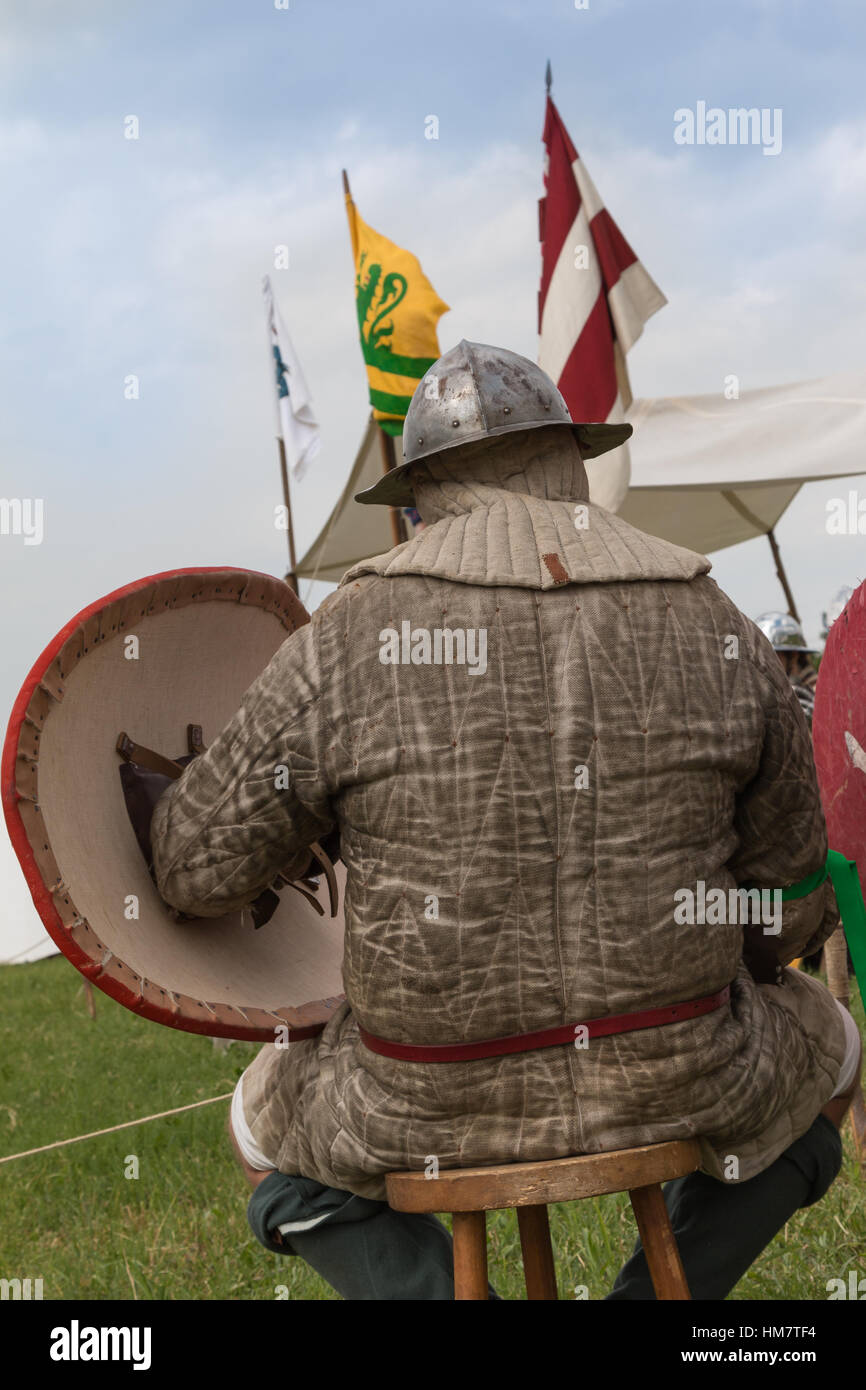 Knight with Helmet and Shield seated on a Chair: Medieval Event ...