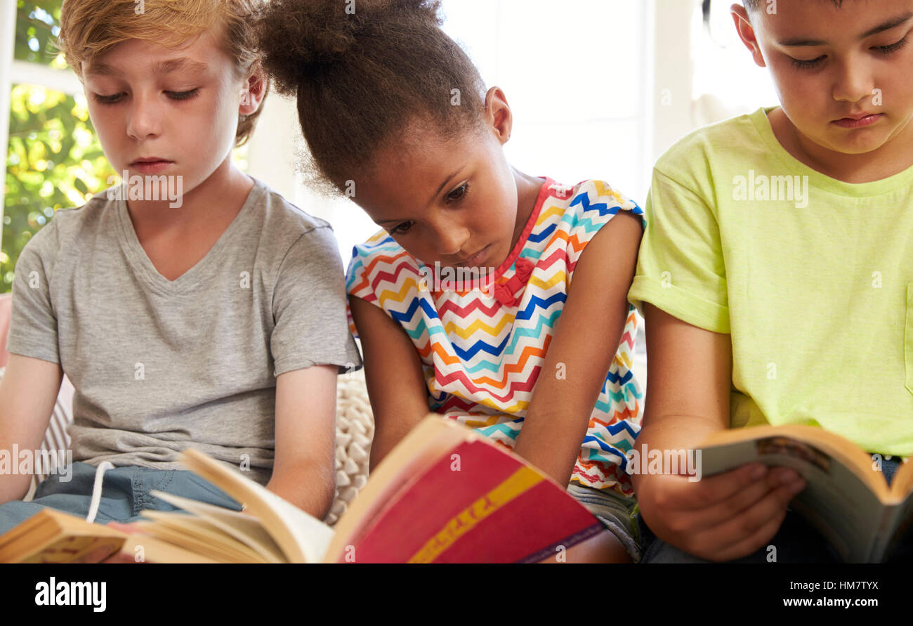 Child reading window seat hi-res stock photography and images - Alamy