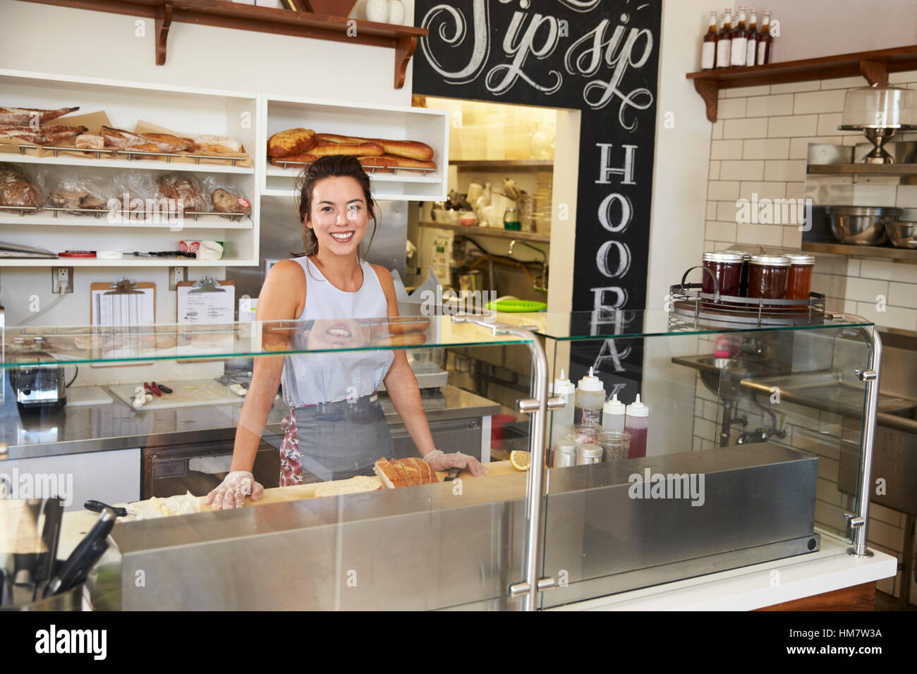 Shopkeeper standing behind counter hi-res stock photography and images ...