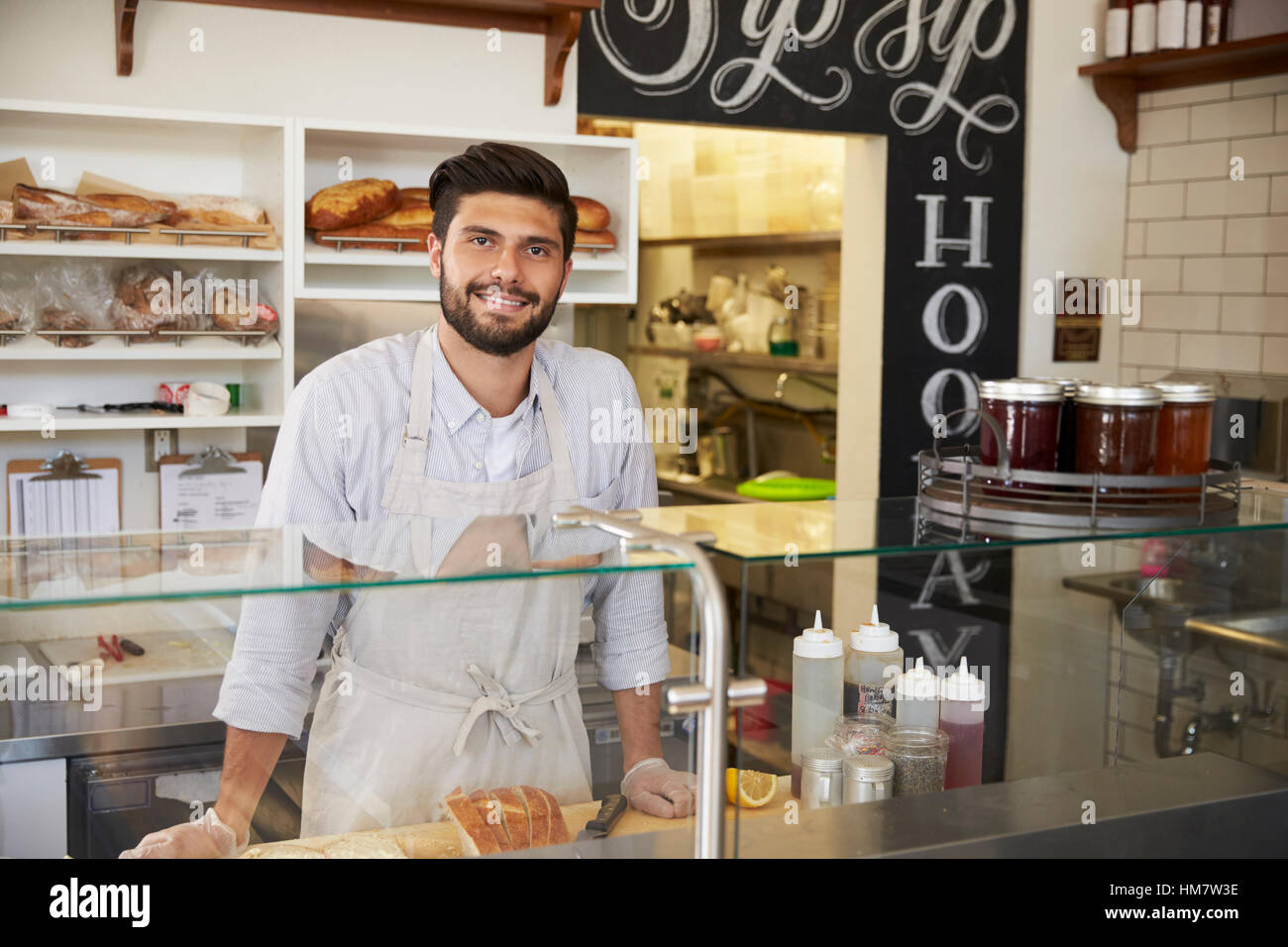Shopkeeper standing behind counter hi-res stock photography and images ...