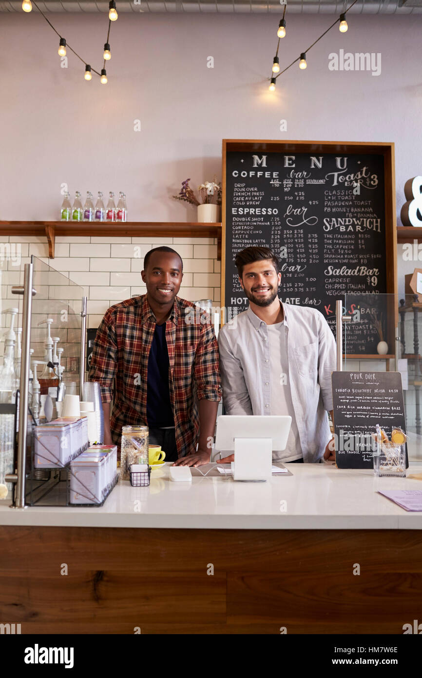 Business partners at counter of coffee shop hi-res stock photography ...