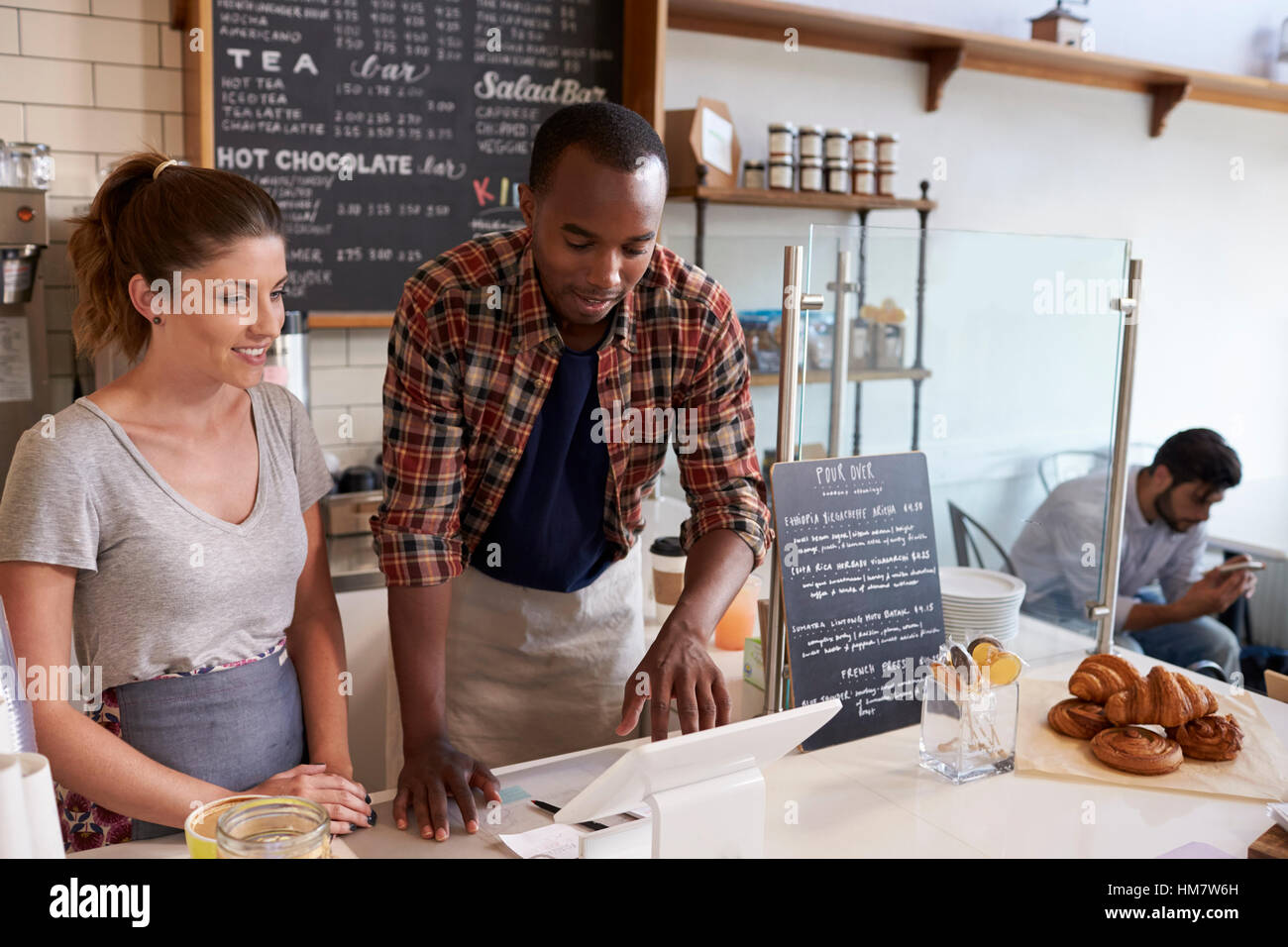 Portrait smiling barista pointing hi-res stock photography and images ...