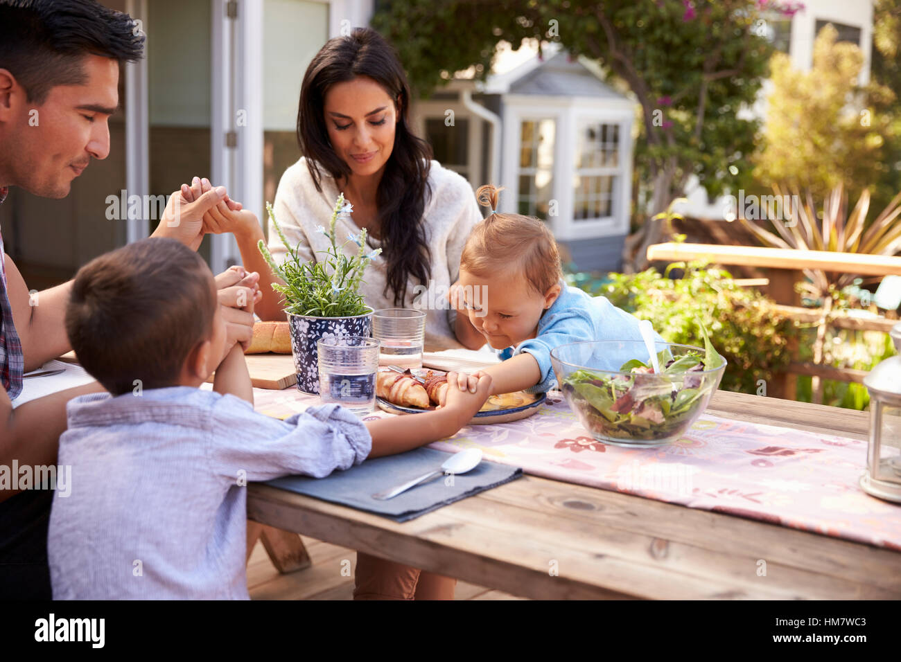 Family At Home Eating Outdoor Meal In Garden Together Stock Photo - Alamy