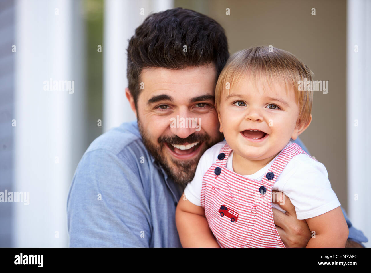 Outdoor Portrait Of Father Holding Son Stock Photo - Alamy