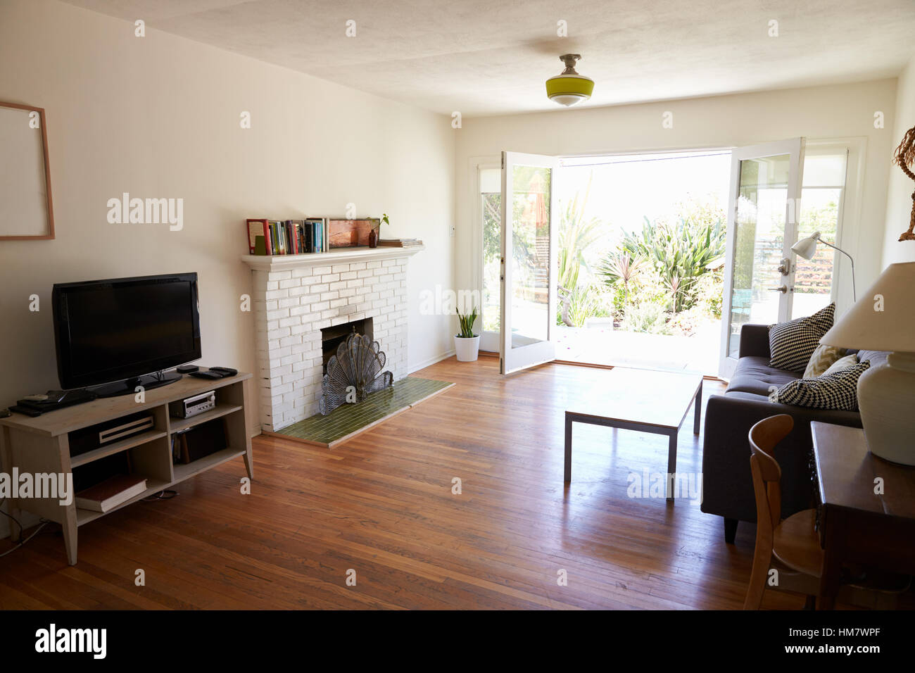 Interior Of Modern Lounge With Open French Windows To Garden Stock ...