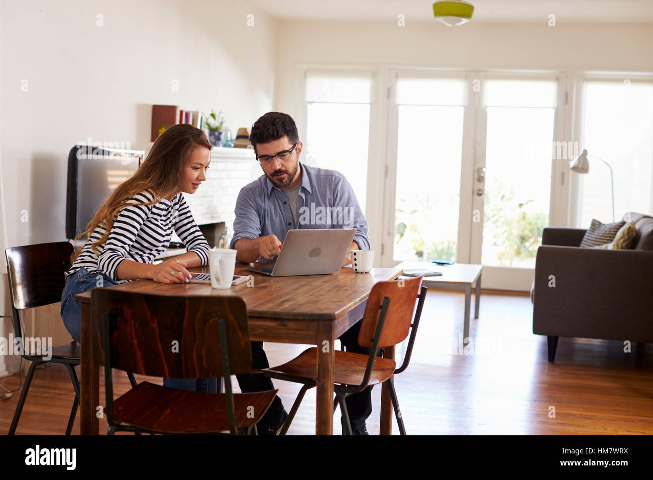 Couple sitting table together hi-res stock photography and images - Alamy
