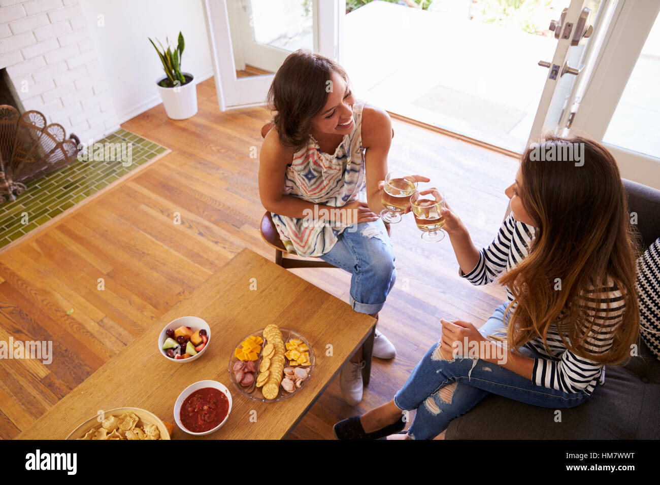 Two Female Friends Socializing Together At Home Stock Photo - Alamy