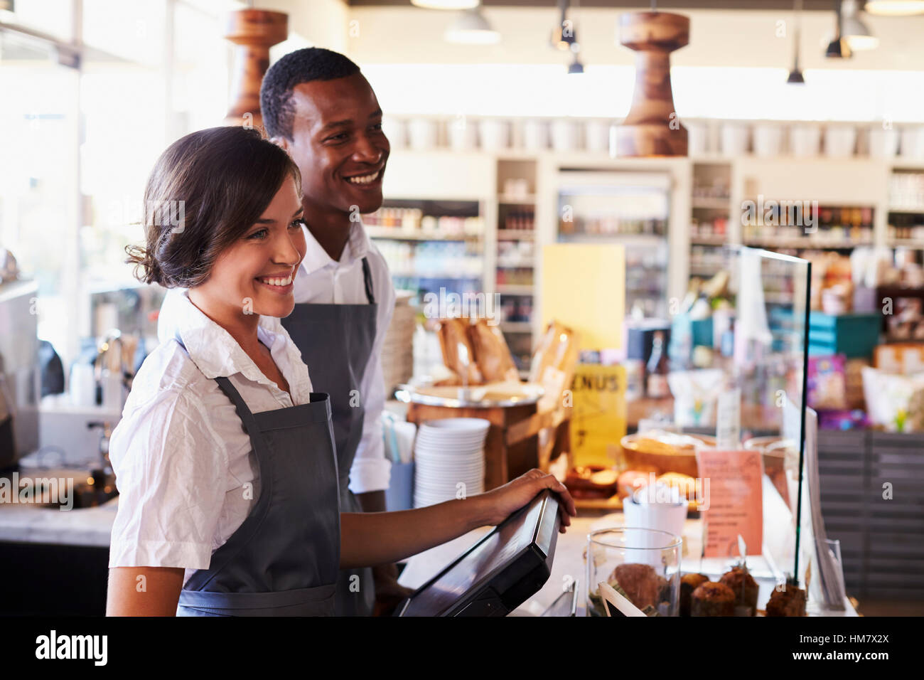 Staff helping customers hi-res stock photography and images - Alamy