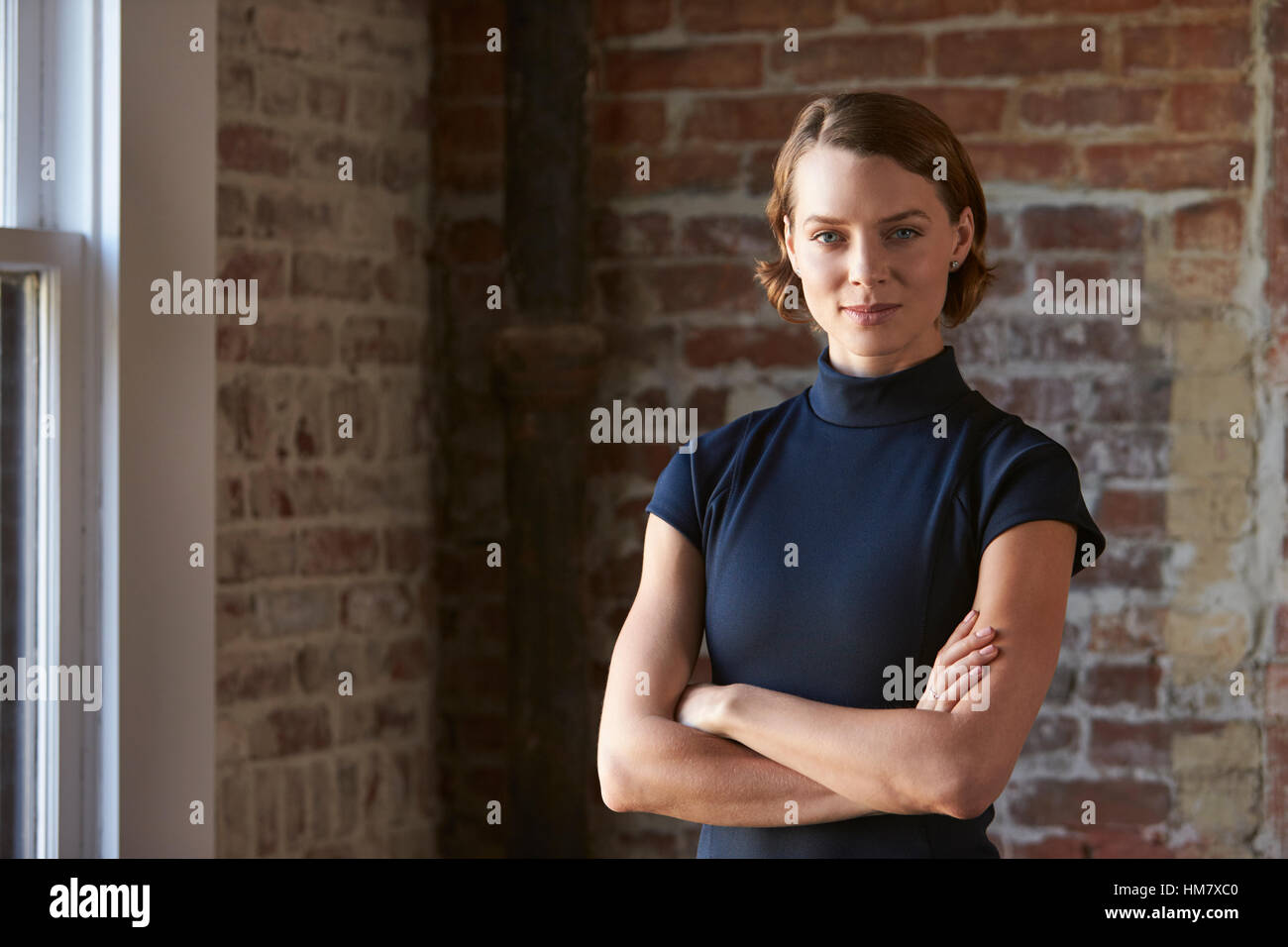 Head And Shoulders Portrait Of Young Businesswoman In Office Stock ...