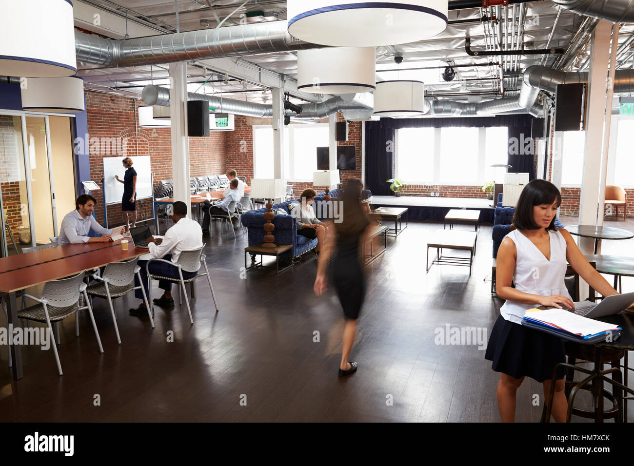 Interior Of Busy Design Office With Staff Stock Photo - Alamy