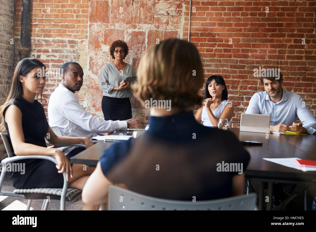 Mature businessman addressing group hi-res stock photography and images ...