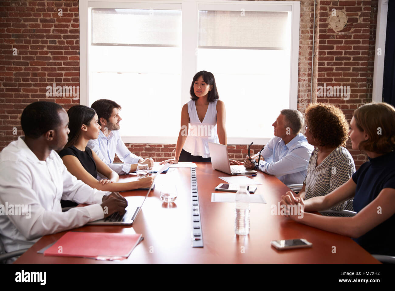 Mature businessman addressing group hi-res stock photography and images ...