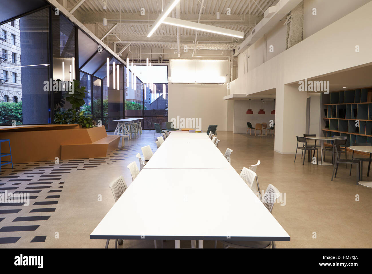 Tables and seating in an empty corporate business cafeteria Stock Photo ...