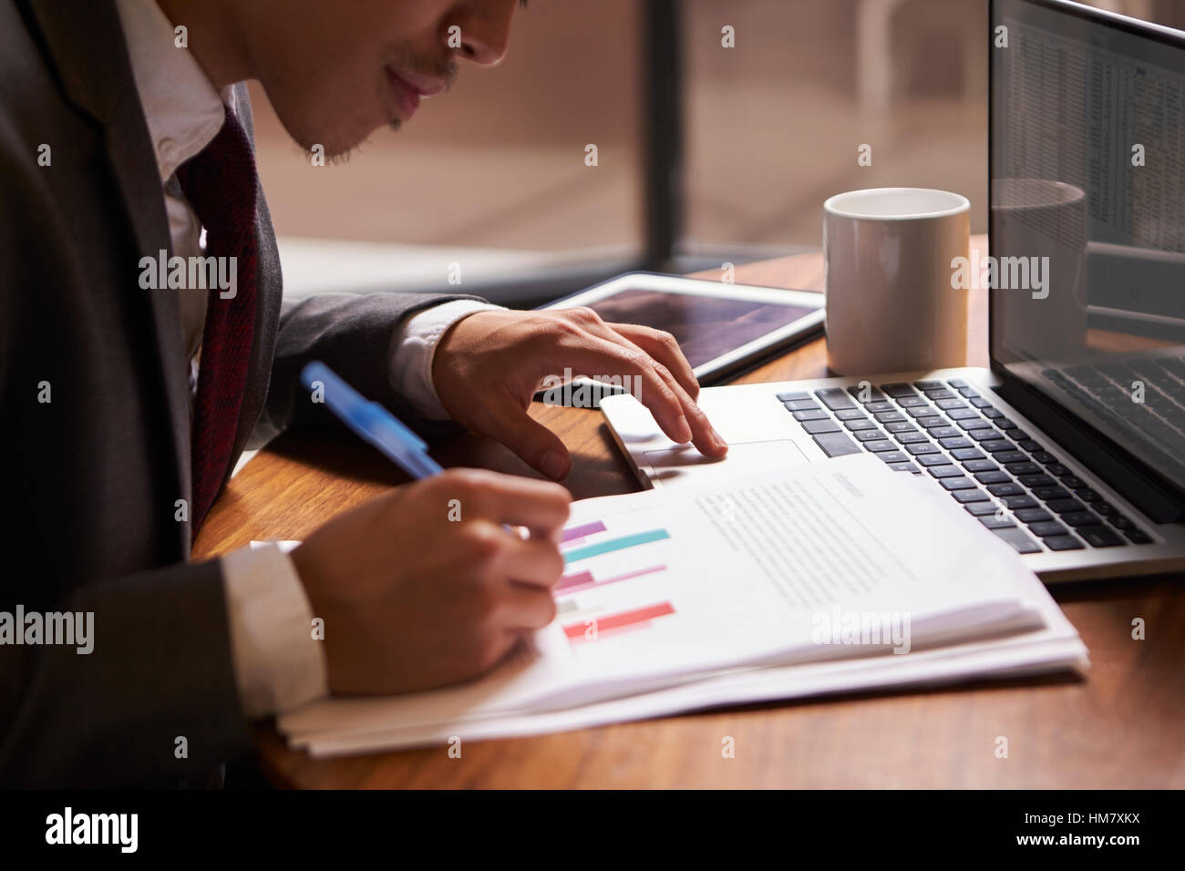 Businessman preparing a document, close up, side view Stock Photo - Alamy