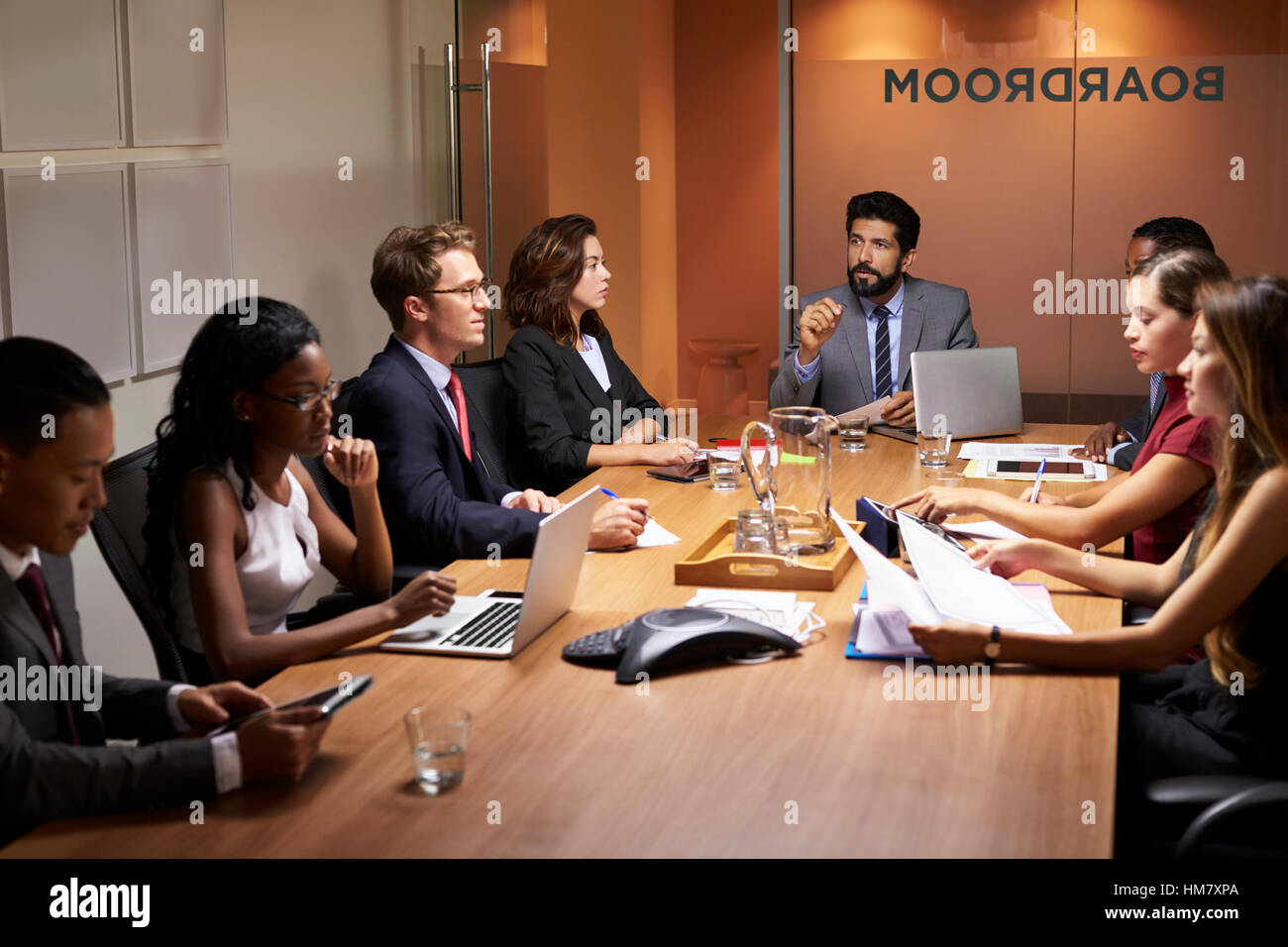 Corporate business people at an evening boardroom meeting Stock Photo ...