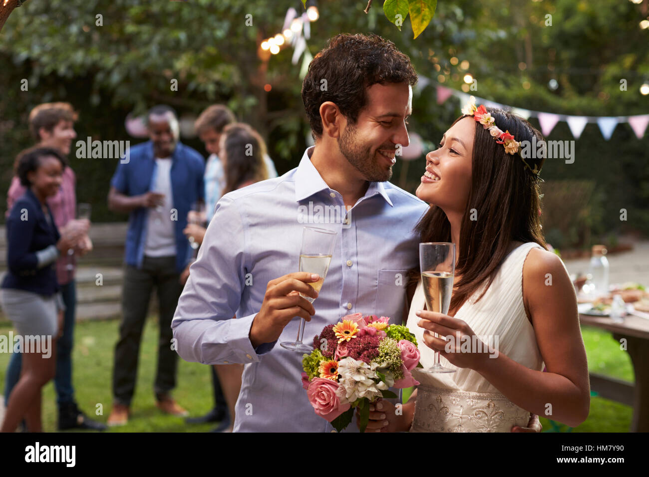 Young Couple Celebrating Wedding With Party In Backyard Stock Photo - Alamy
