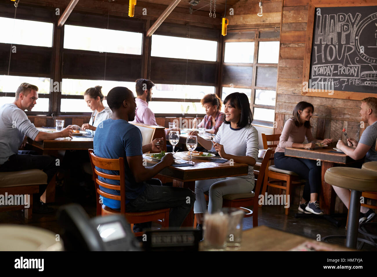 Couples enjoying lunch in a busy restaurant Stock Photo - Alamy