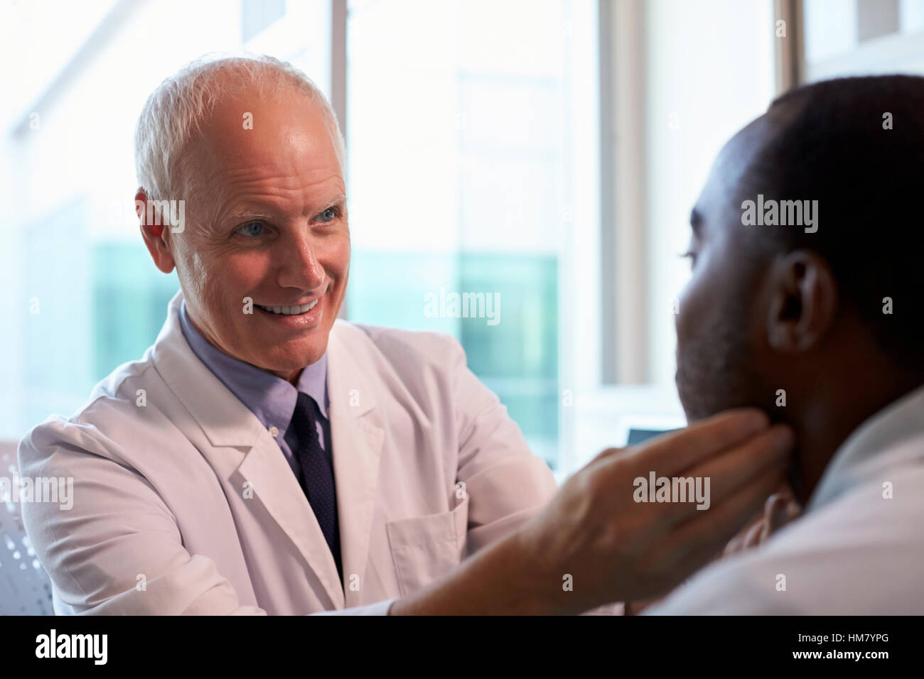 White doctor black patient hi-res stock photography and images - Alamy