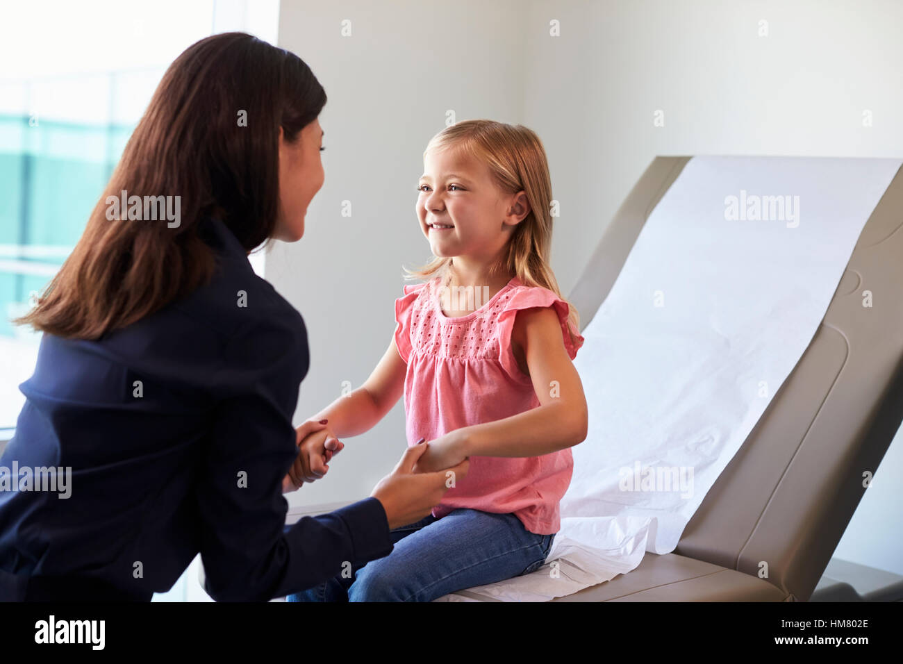 Pediatrician With Child In Exam Room Stock Photo - Alamy