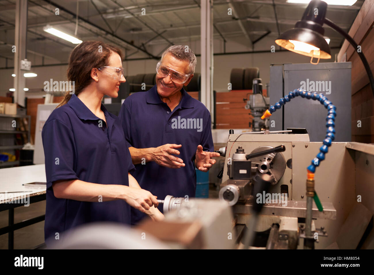 Engineer Training Female Apprentice On Milling Machine Stock Photo - Alamy