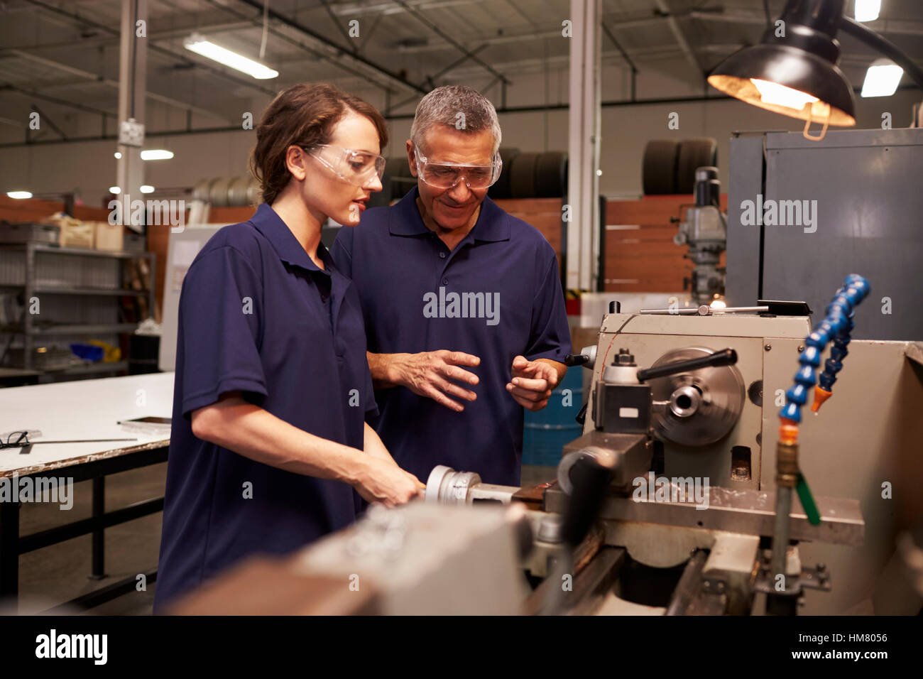 Engineer Training Female Apprentice On Milling Machine Stock Photo - Alamy