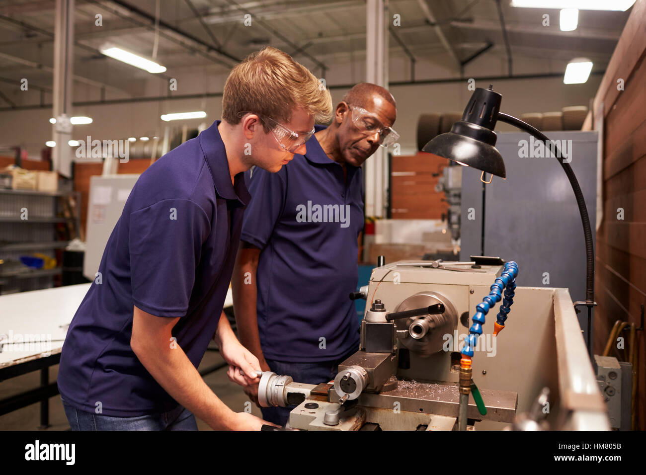 Engineer Training Male Apprentice On Milling Machine Stock Photo - Alamy