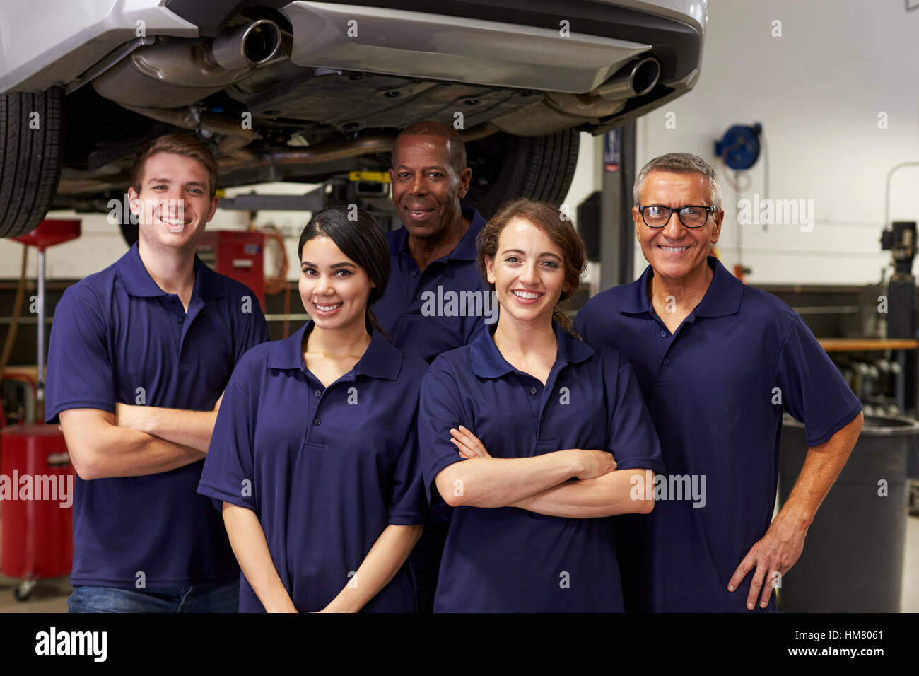 Portrait Of Auto Mechanics Working In Garage Stock Photo - Alamy