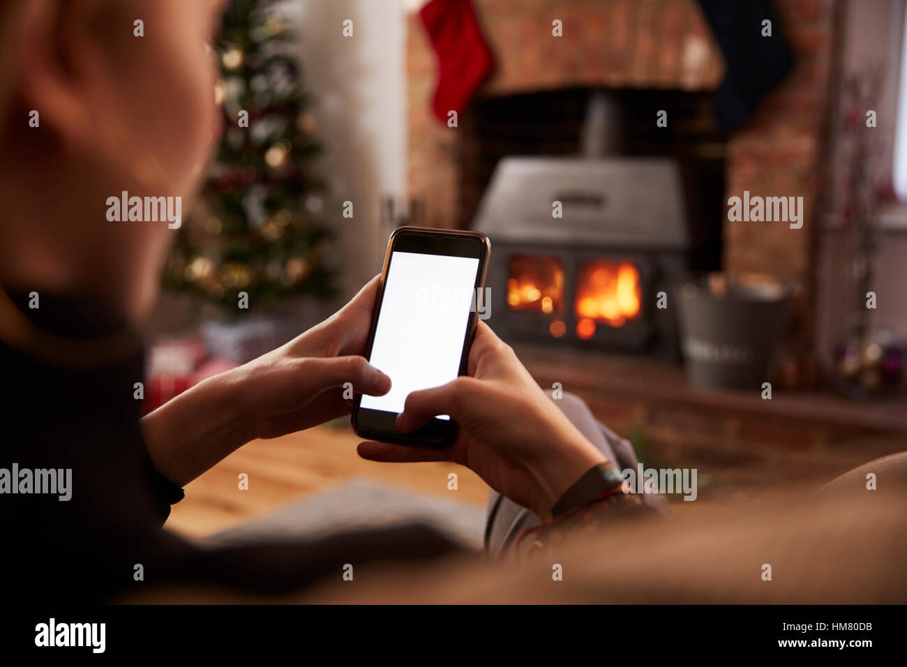 Man Using Mobile Phone In Room Decorated For Christmas Stock Photo - Alamy