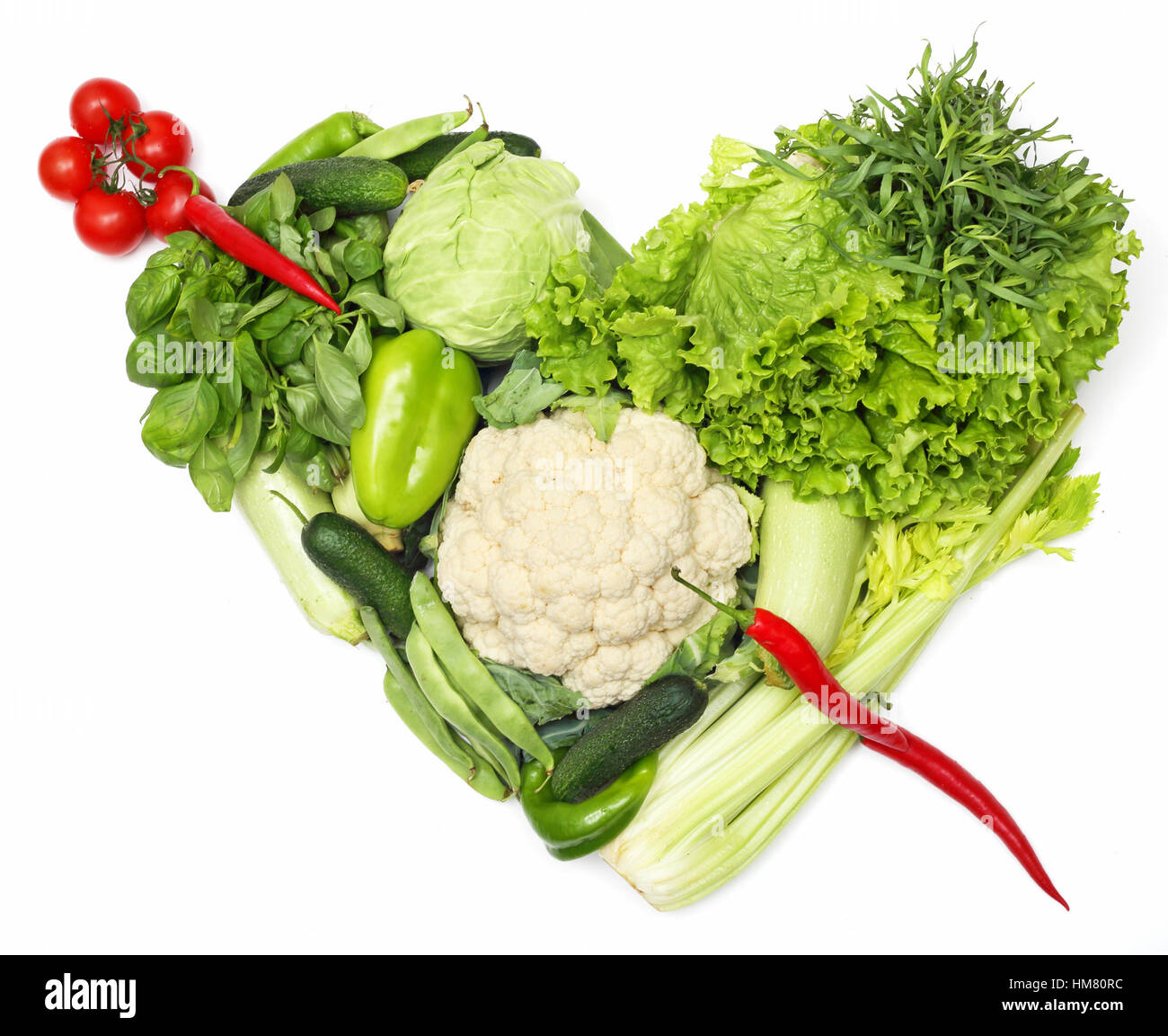 Pile of vegetables shaped as heart isolated on white background Stock ...