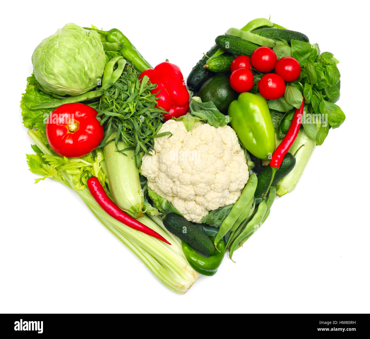 Love vegetables concept, pile of vegetables shaped as heart isolated on ...