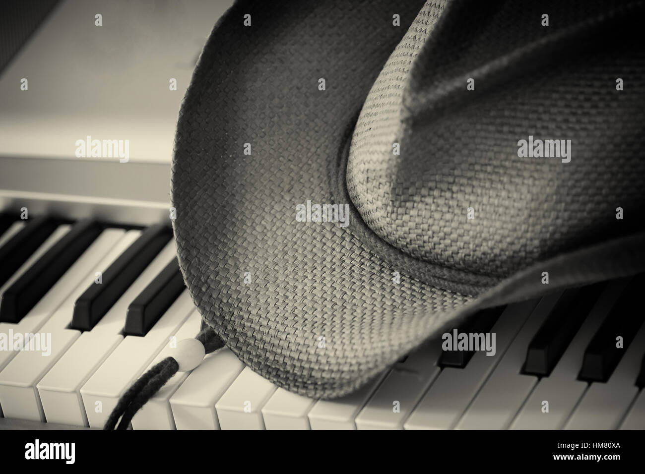 Cowboy hat on top of piano keyboard Stock Photo - Alamy