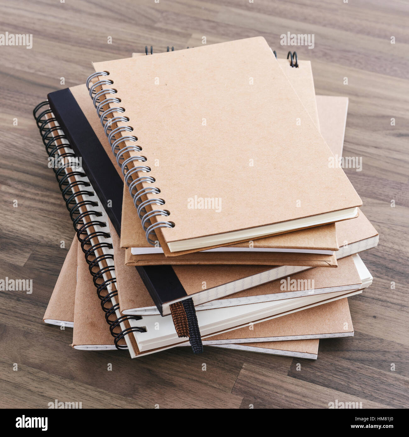 Notebook stack mockup on wood table Stock Photo - Alamy