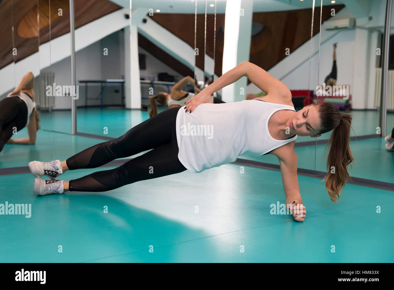 Full length of young beautiful woman with perfect bodies in sportswear ...