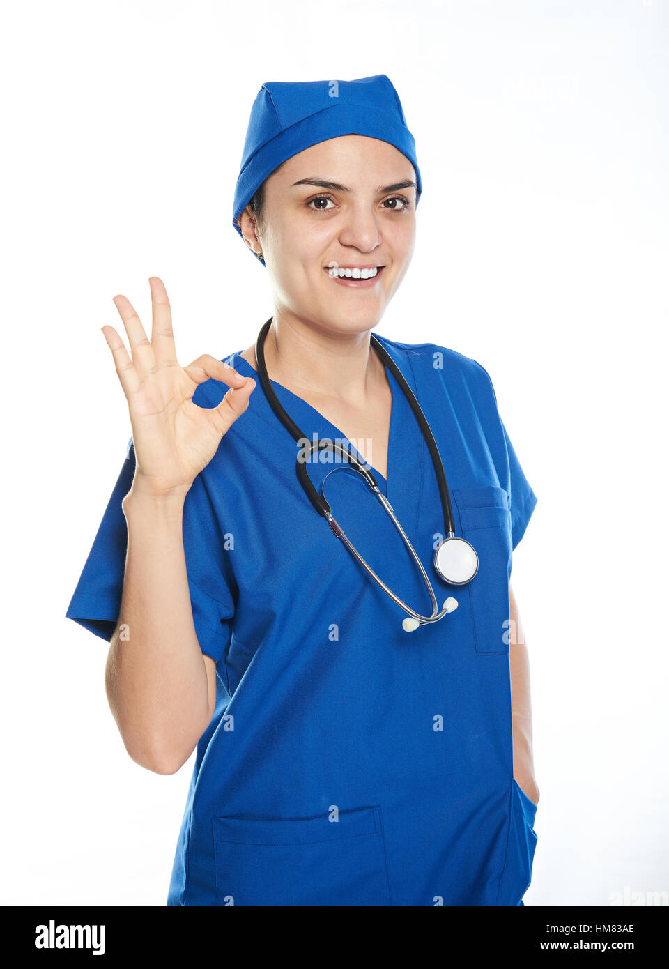 young woman doctor make good sign isolated on white Stock Photo - Alamy