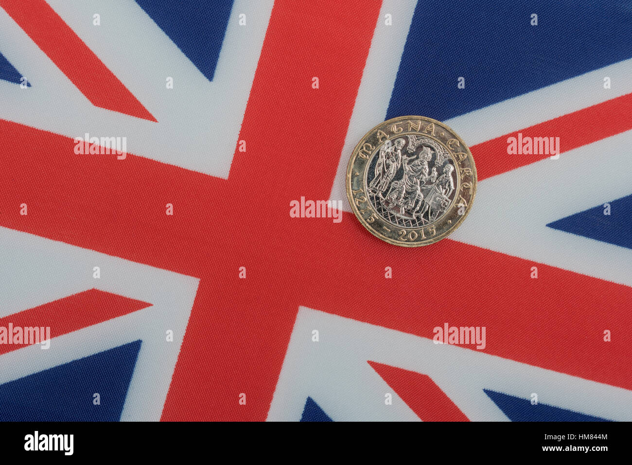 Union Jack with £2 Magna Carta commemorative coin Stock Photo - Alamy