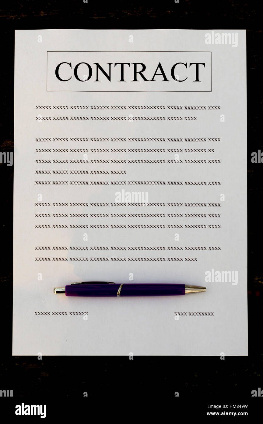 A filled contract on a black background Stock Photo - Alamy