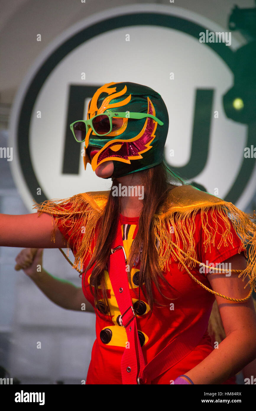 Woman on stage with face mask Stock Photo - Alamy