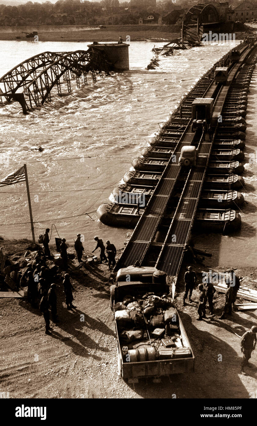 The war over, German soldiers here are crossing a pontoon bridge from ...