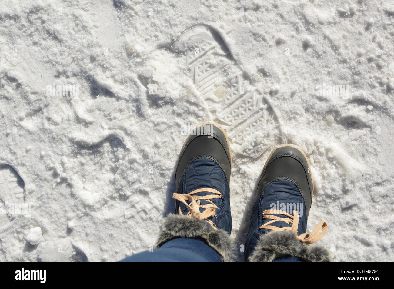 Footprint on snow Stock Photo - Alamy