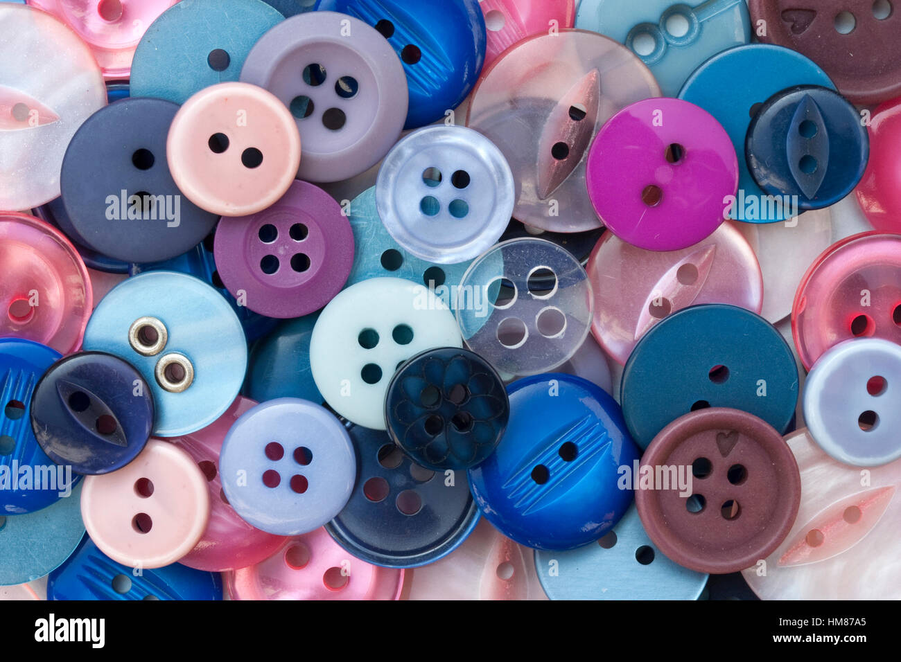 Pink and blue sewing buttons Stock Photo - Alamy