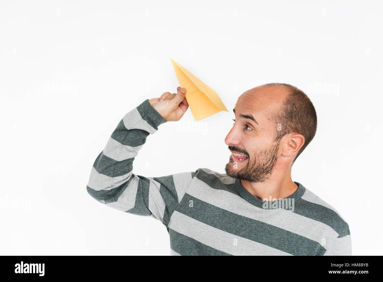 Mature guy flying a paper plane Stock Photo - Alamy