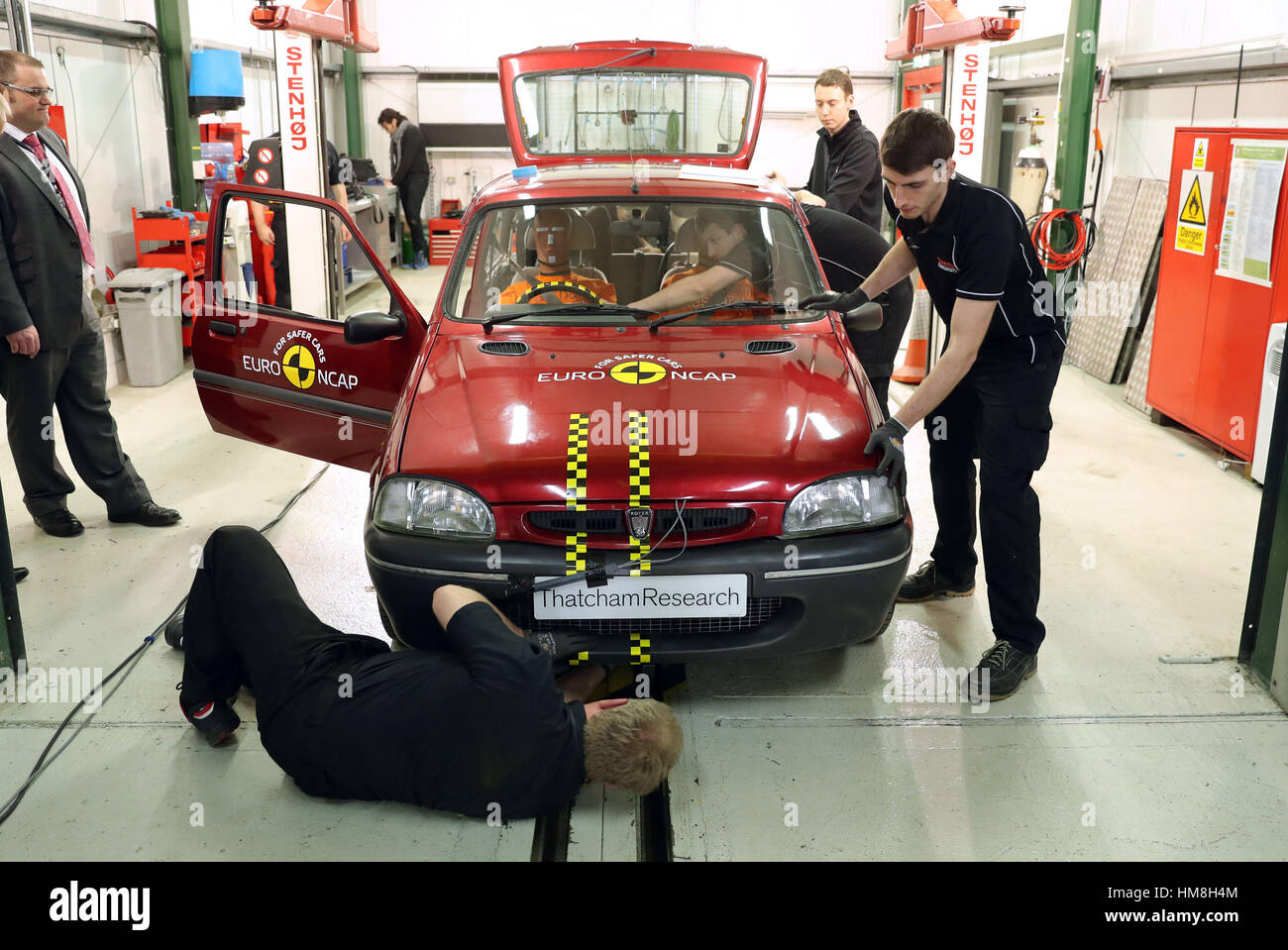 EMBARGOED TO 0001 THURSDAY FEBRUARY 2 Technicians prepare a 1997 Rover ...
