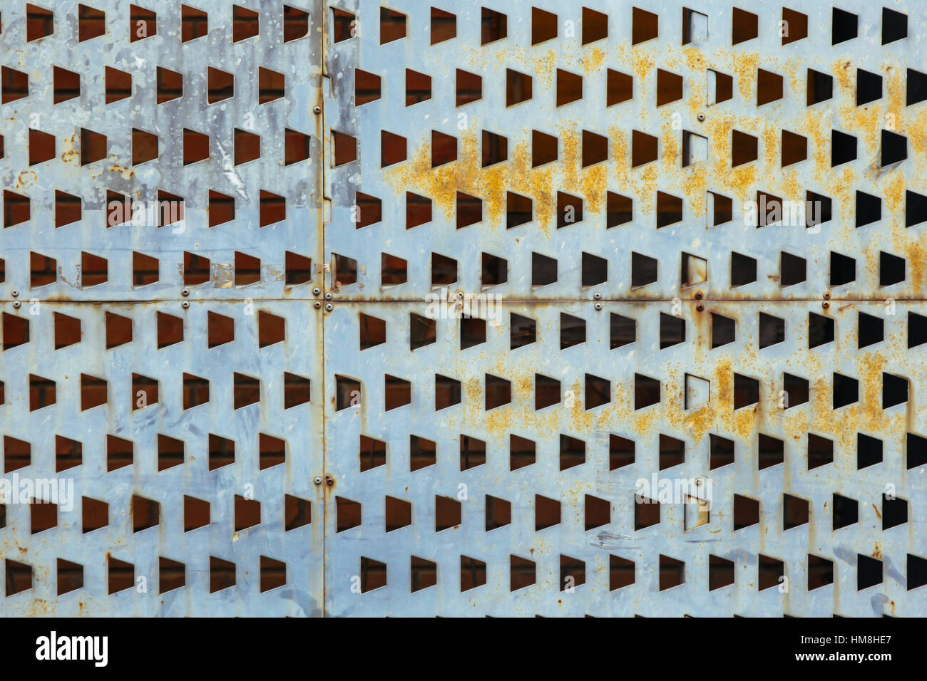 Pentagon shape holes in grey metal sheet abtract texture background ...