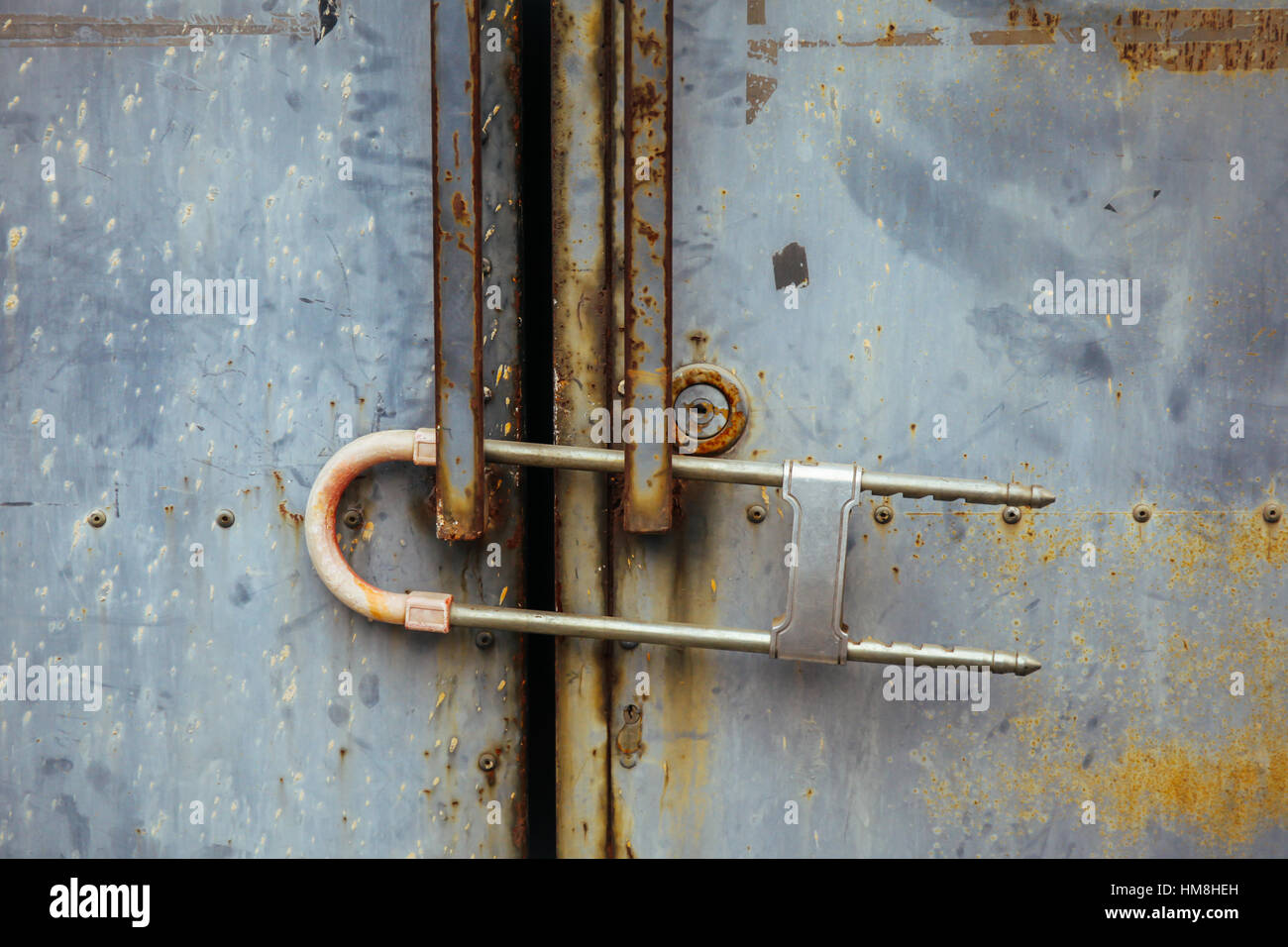 Close-up of rusty metal gate locked with security padlock Stock Photo ...