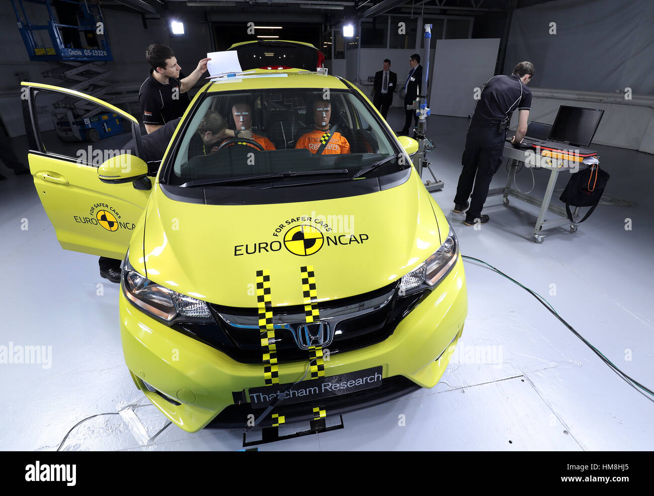 EMBARGOED TO 0001 THURSDAY FEBRUARY 2 Technicians prepare a Honda Jazz ...