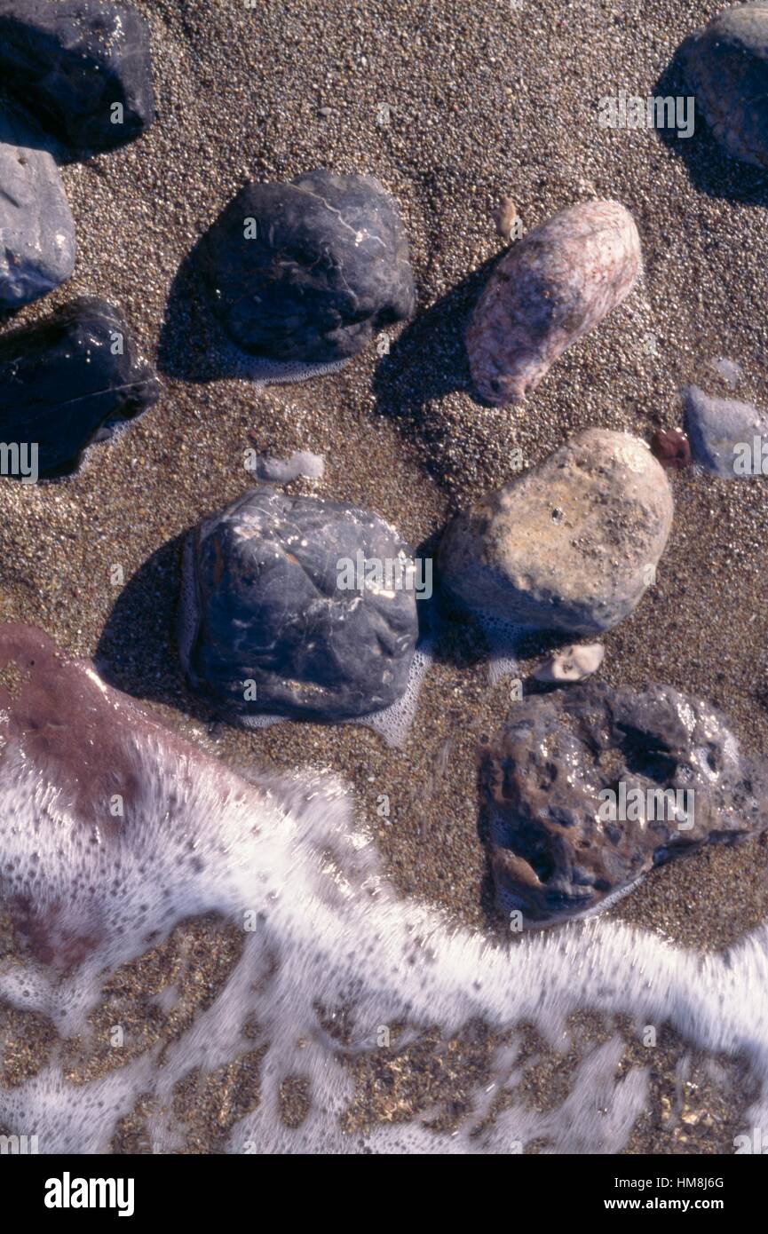 Rocks being lapped by the water on Itanos beach, Crete, Greece Stock ...