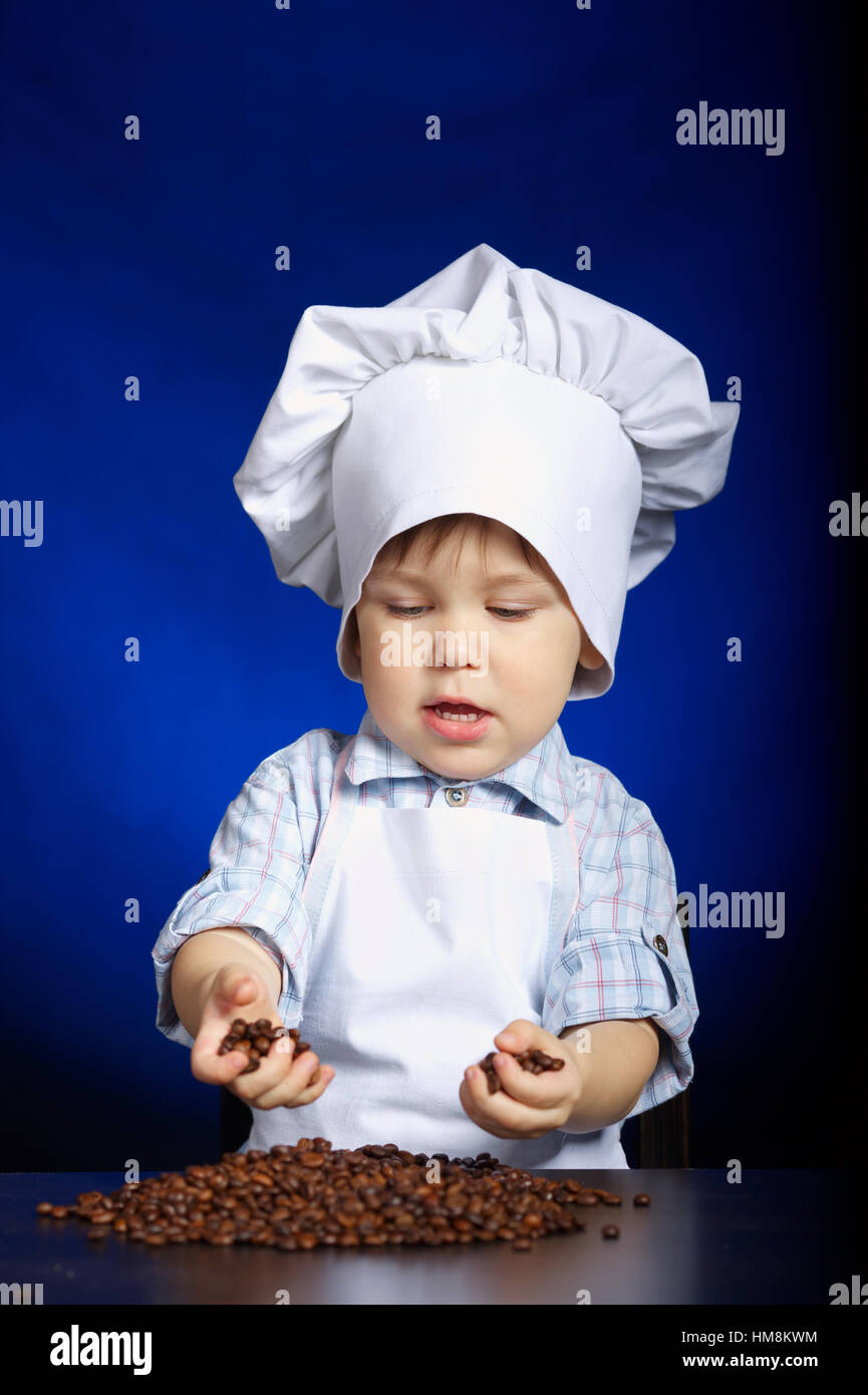 little boy checking coffee grains Stock Photo - Alamy
