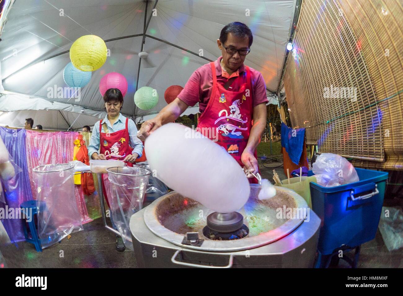 Man selling cotton candy in hi-res stock photography and images - Alamy