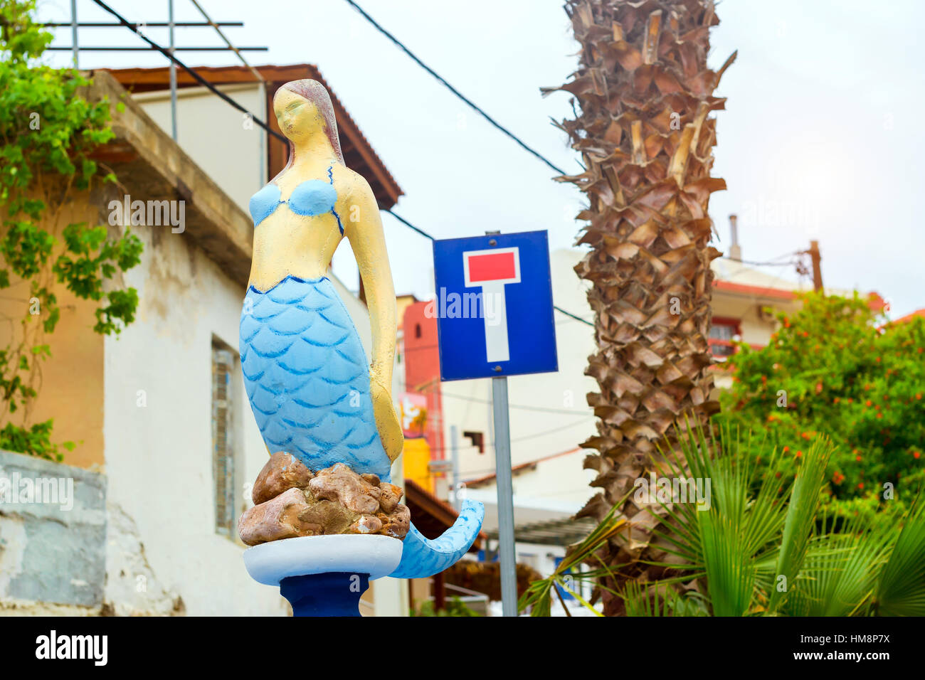 Decorative fountain with stone statue of mermaid. Modern and classic ...